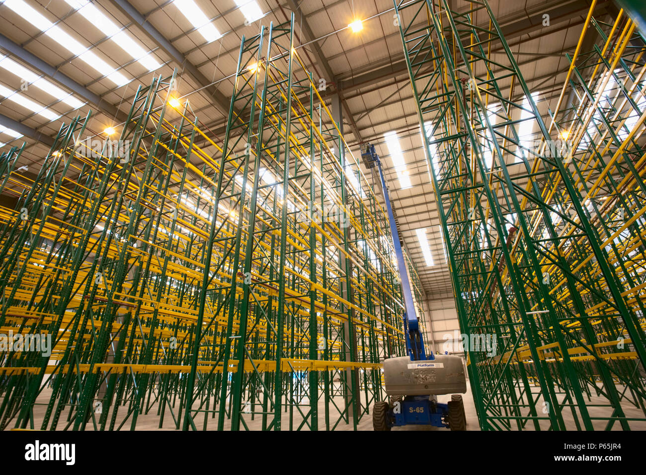 Empty warehouse with shelving and racks Stock Photo - Alamy