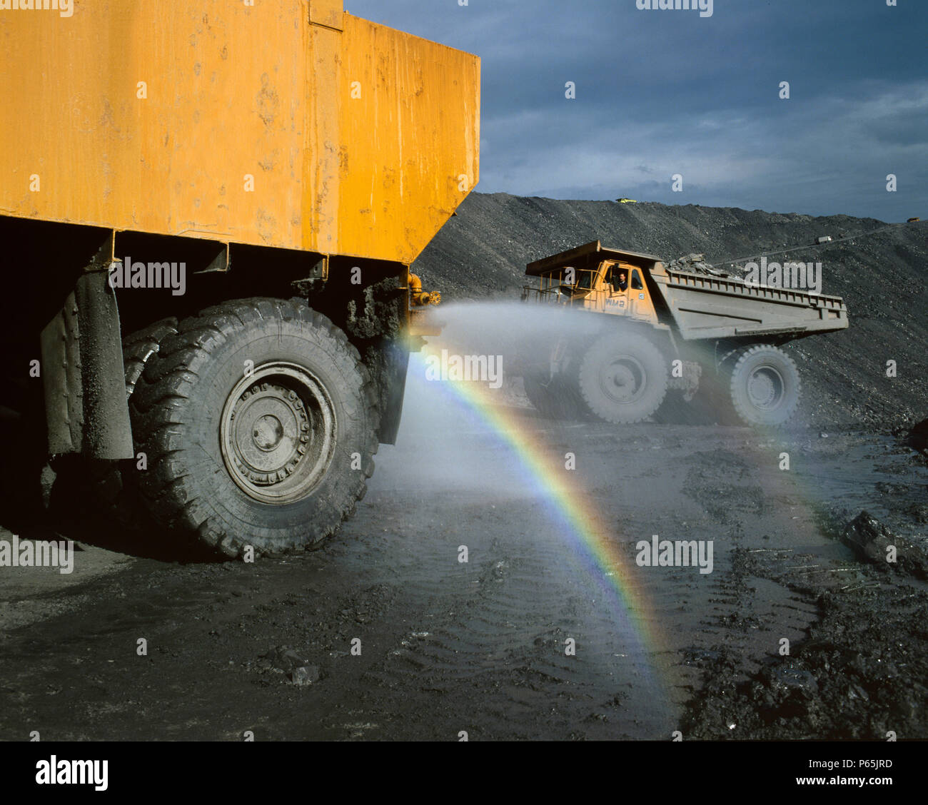 Dust suppression using water spray at open cast coal mine. United ...