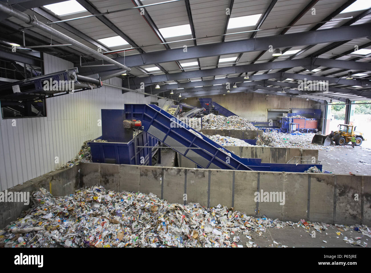 Dumping bays at recycling centre Stock Photo - Alamy