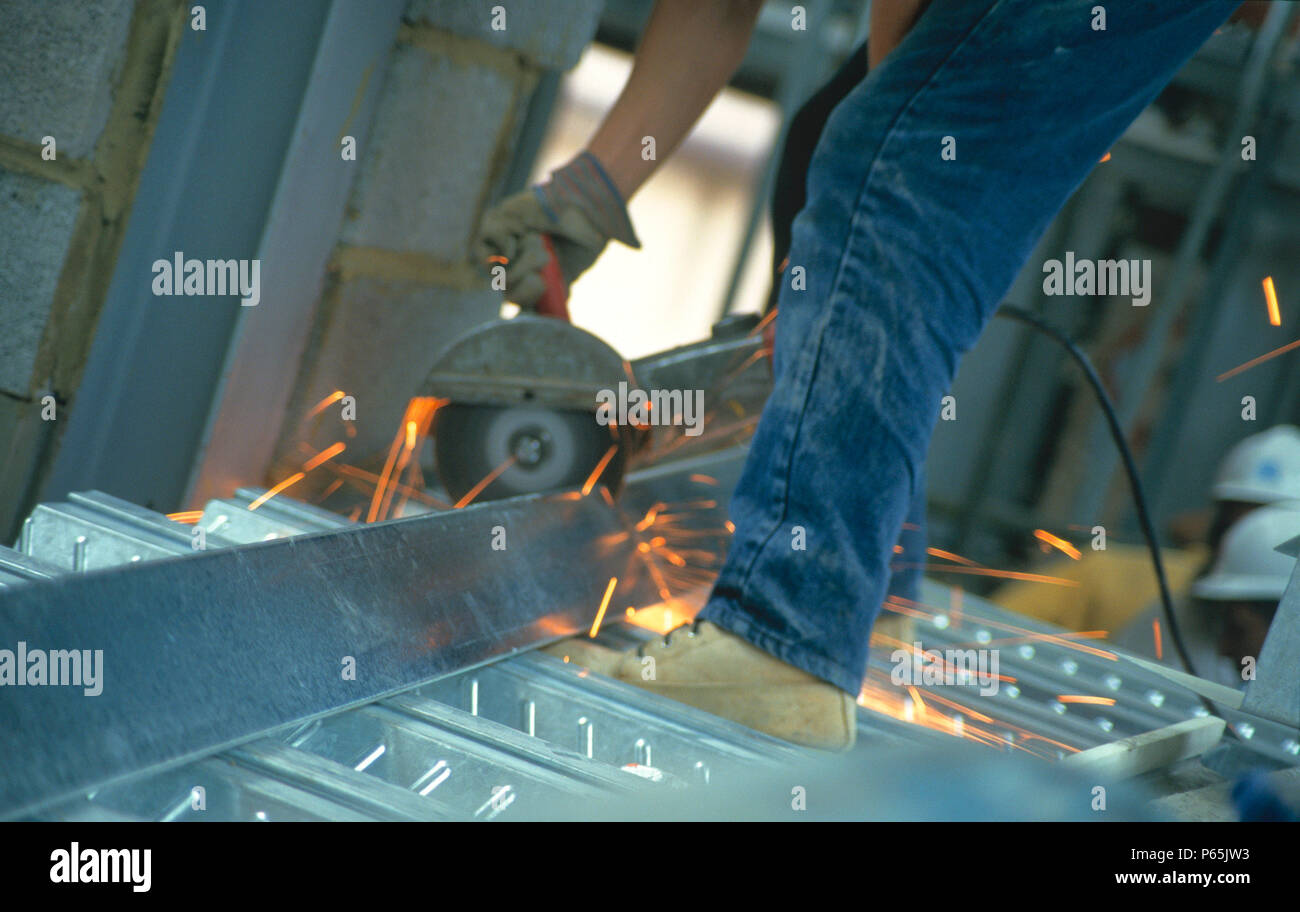 Construction worker cutting steel with a circular saw Stock Photo - Alamy