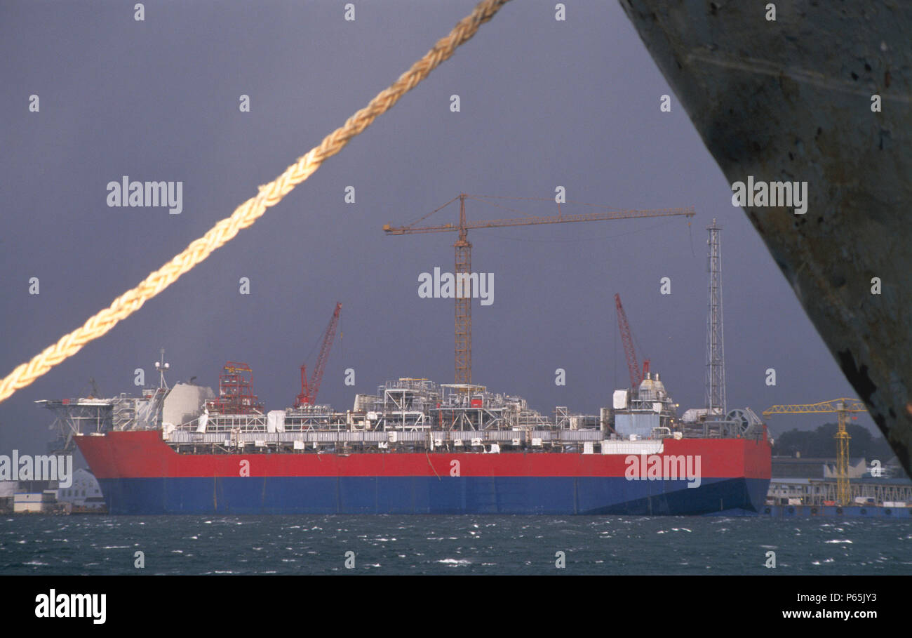 Cargo ship pulling into harbor Stock Photo - Alamy