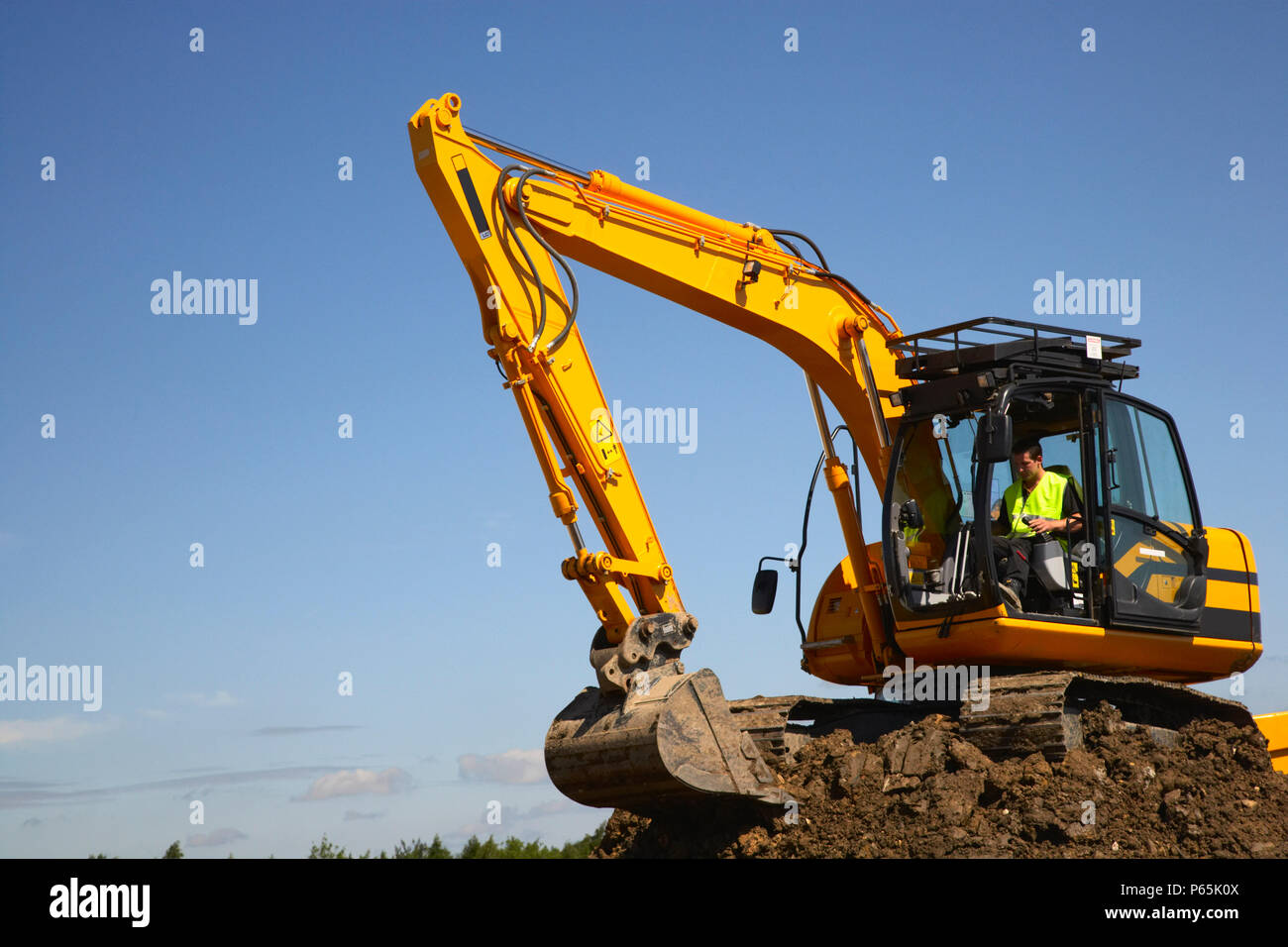 Yellow Digger, UK Stock Photo - Alamy