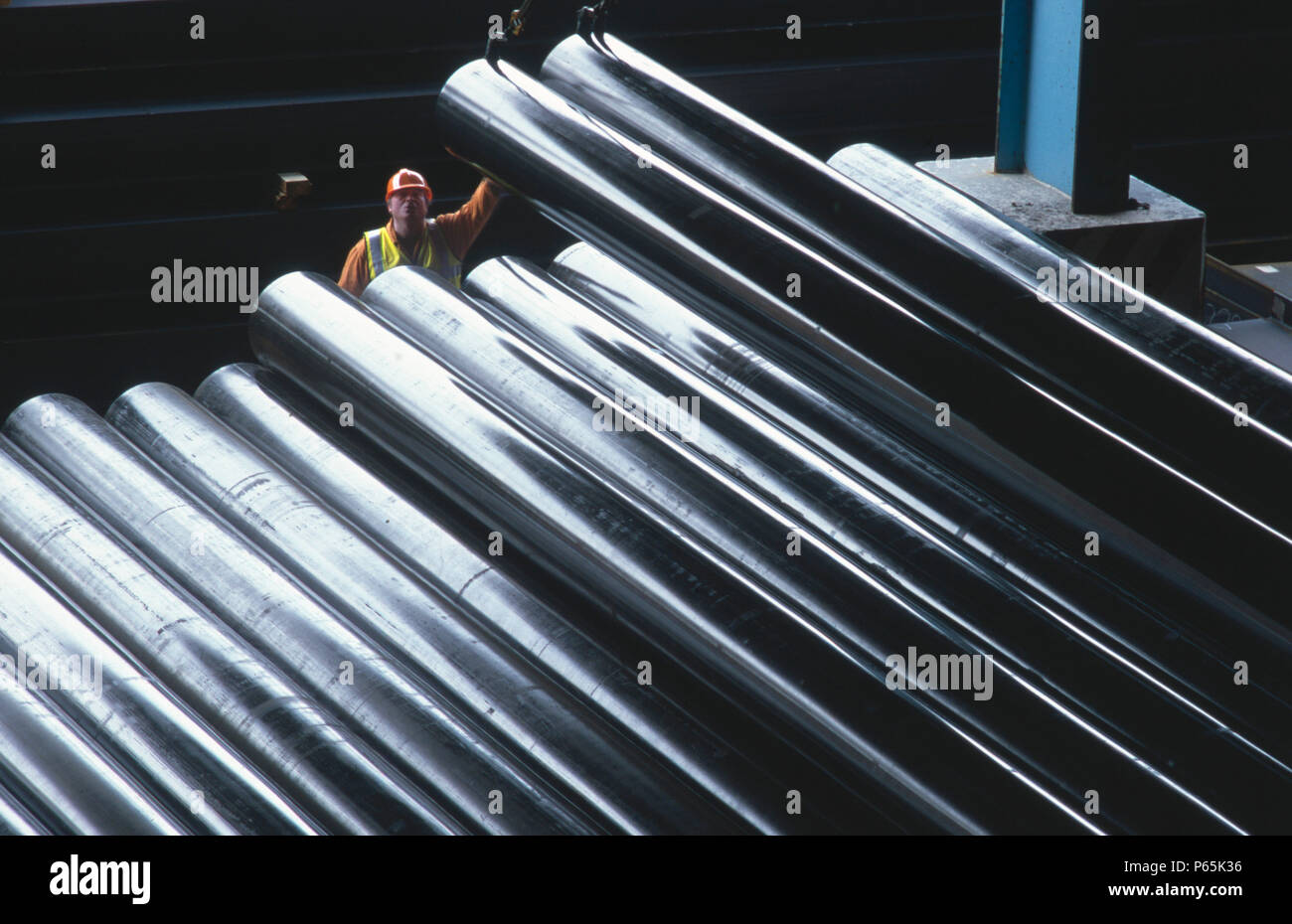 Unloading steel pipes. Teesside Docks, United Kingdom Stock Photo - Alamy