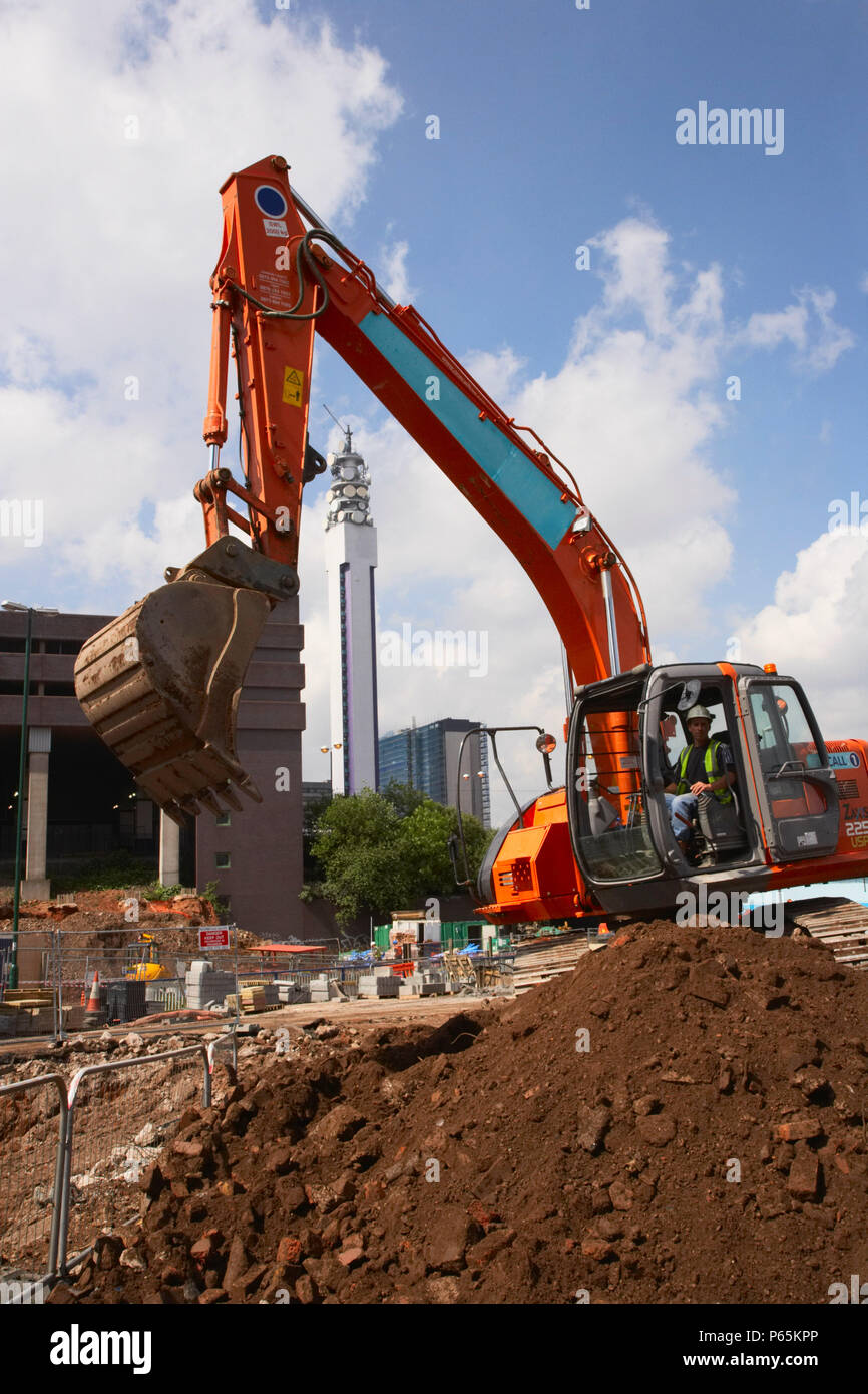 Digger, Birmingham, with BT Tower behind, UK Stock Photo - Alamy