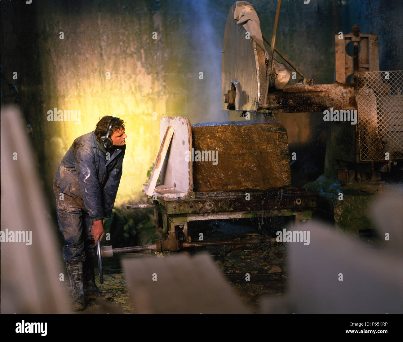 Cutting Portland stone block using large circular saw. Purbeck, United ...