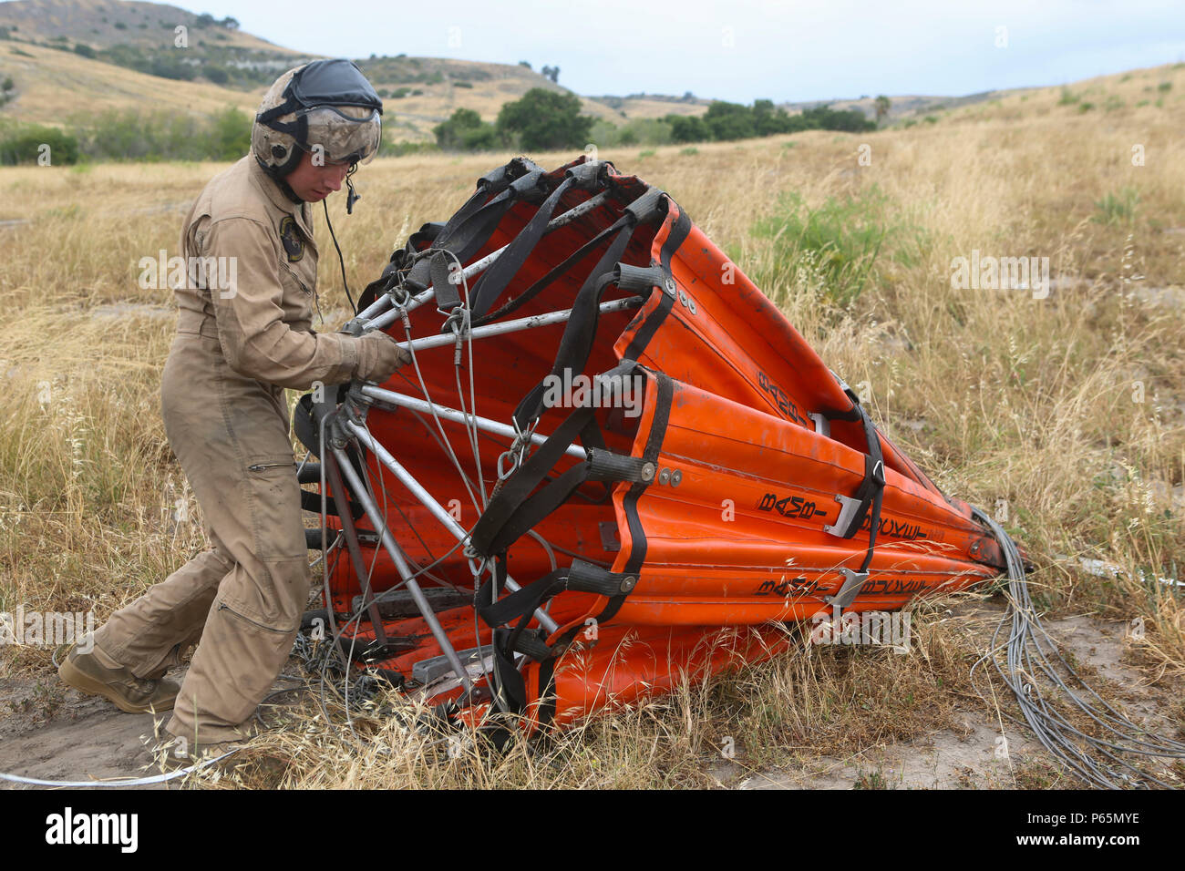 A Marine with Marine Medium Tiltrotor Squadron (VMM) 165 closes a Bambi ...
