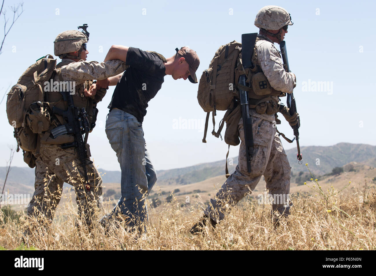 Detainee handling hi-res stock photography and images - Alamy