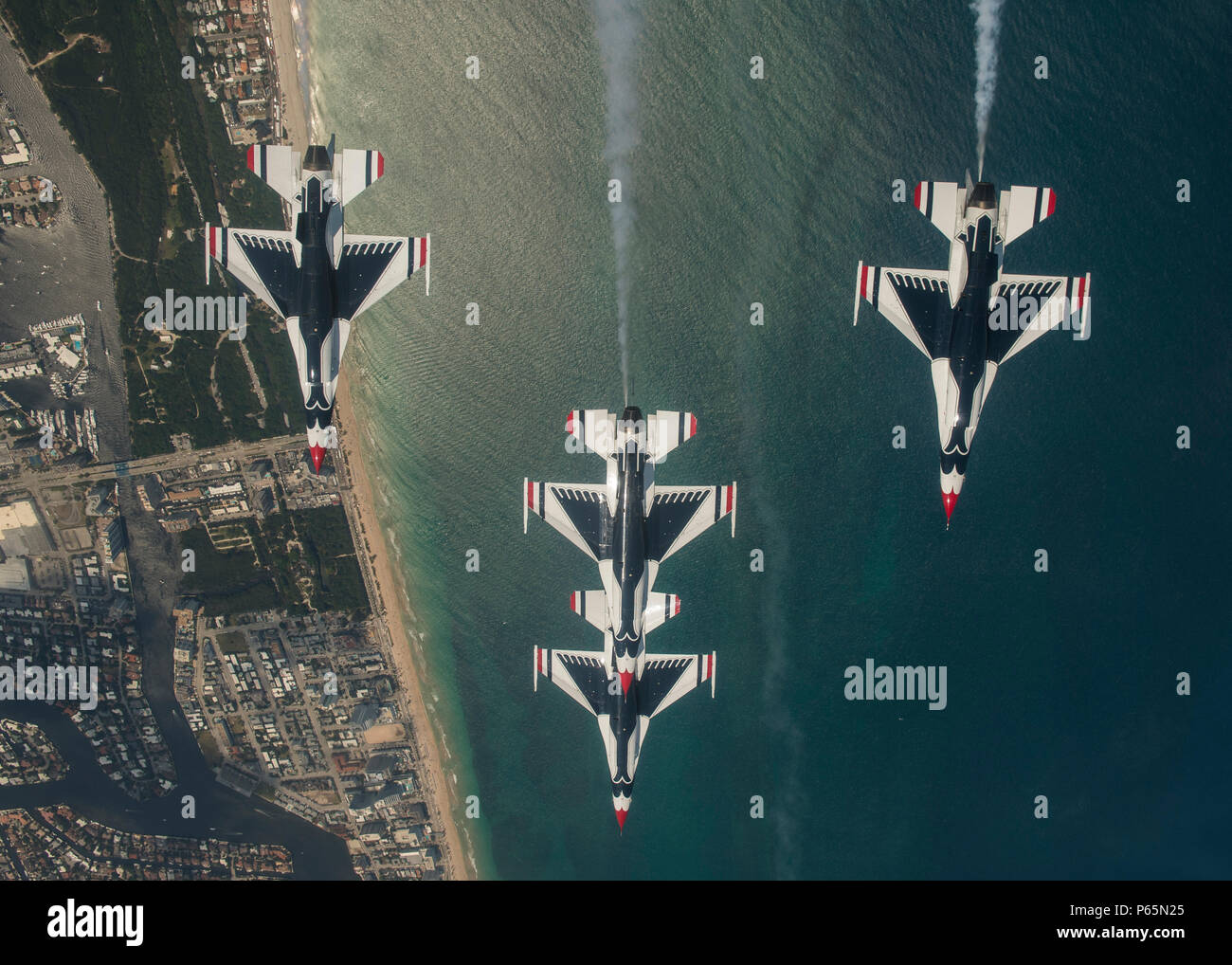 Thunderbirds pilots perform the Arrowhead Loop maneuver during a ...