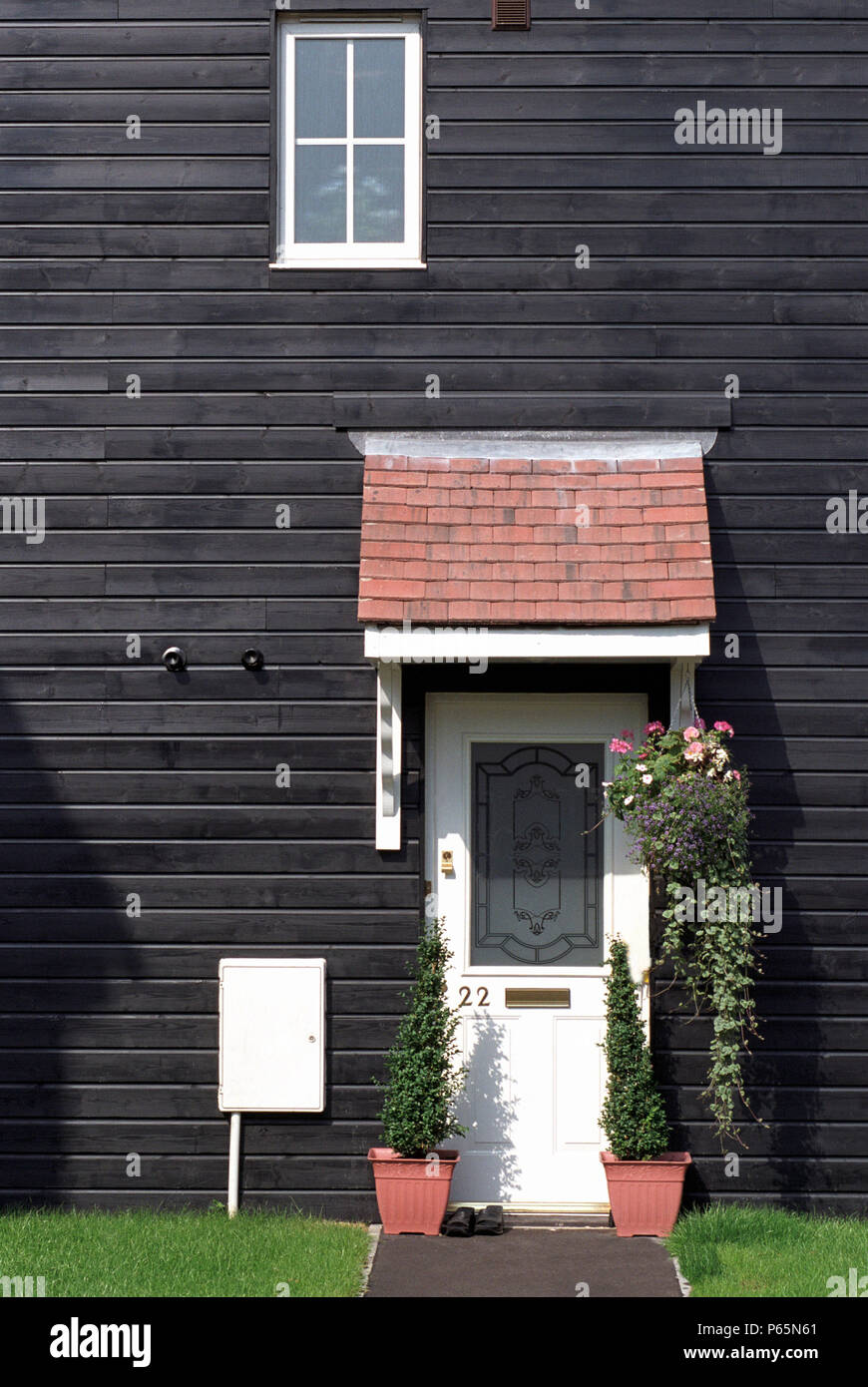 Elevation of front door of modern timber house Stock Photo - Alamy