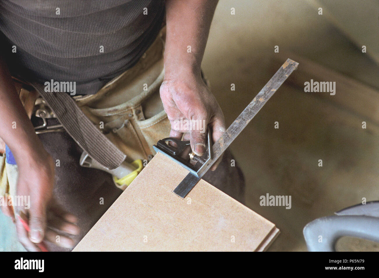 Carpenter measuring wood Stock Photo - Alamy