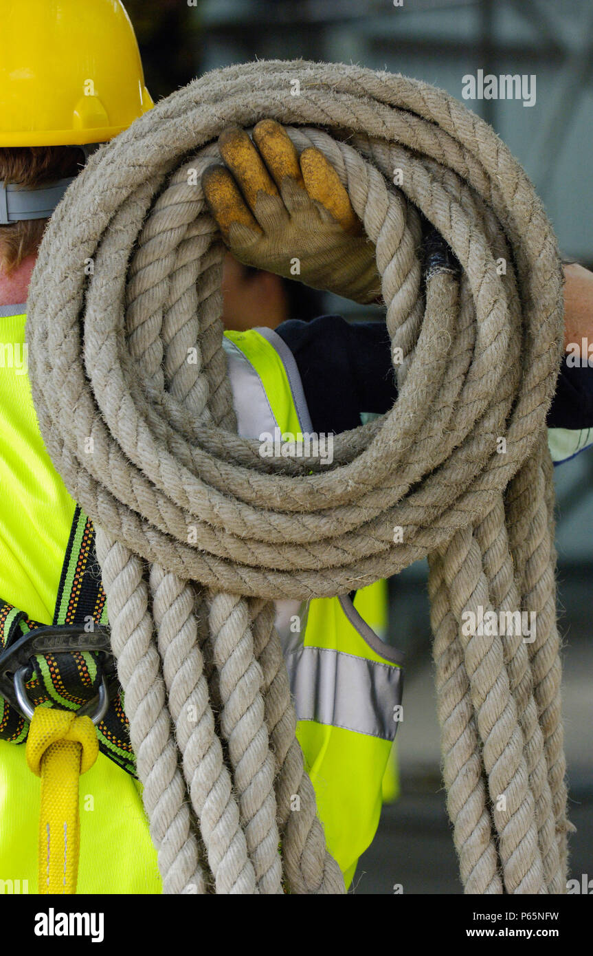 Construction worker with safety belt and rope on his shoulders Stock ...