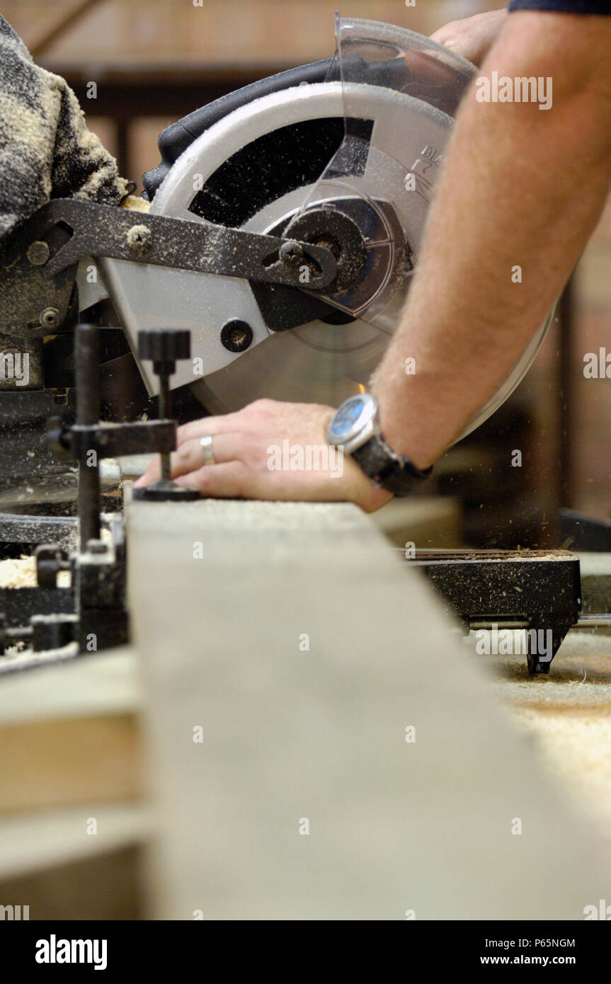 Man operating a circular saw Stock Photo - Alamy