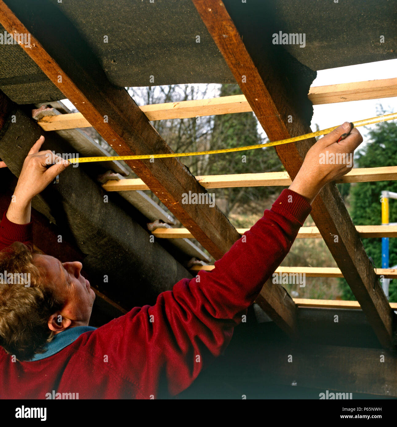 Loft conversion. Cutting a hole in the roof for a new window Stock ...
