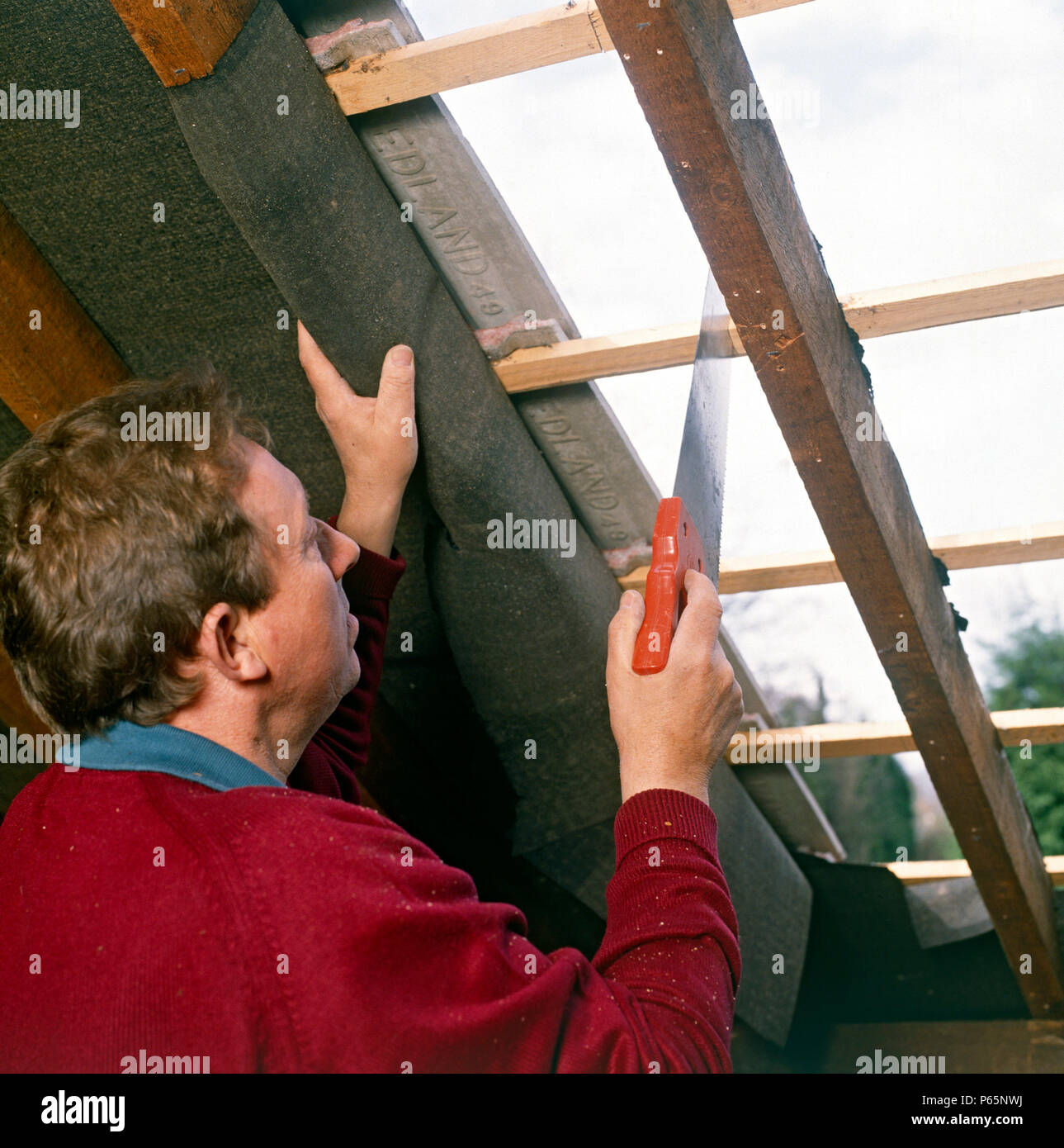Loft Conversion Cutting A Hole In The Roof For A New Window Stock Photo Alamy loft-conversion-cutting-a-hole-in-the-roof-for-a-new-window-stock-photo-alamy
