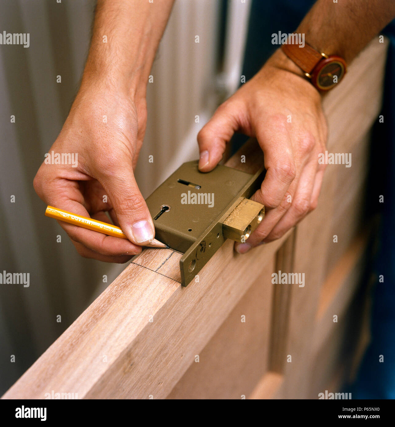 Marking up the lock area with a pencil Stock Photo - Alamy