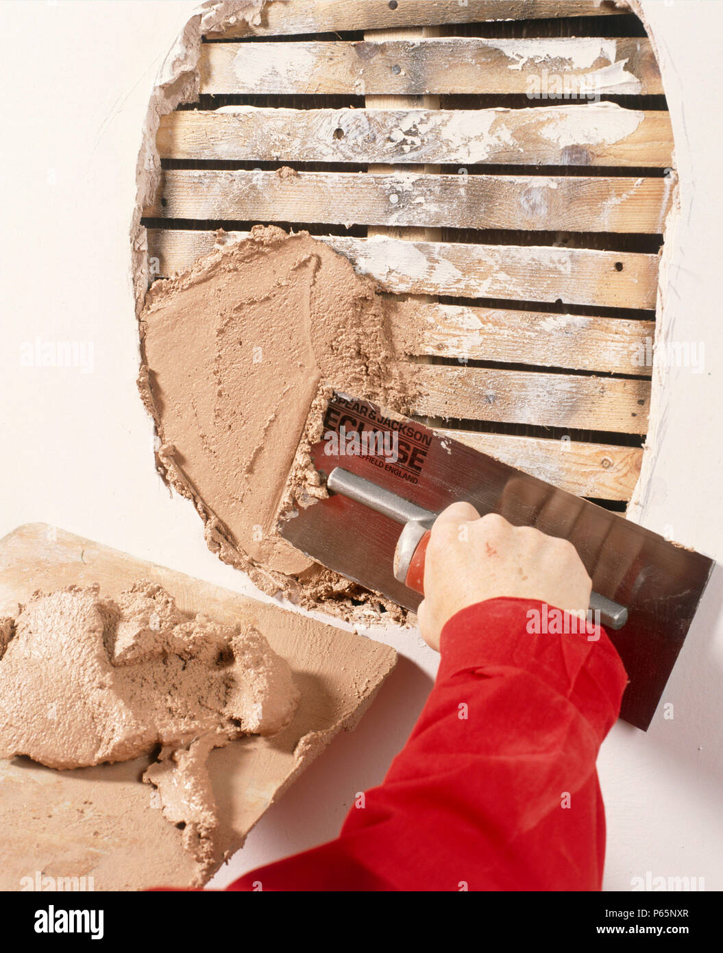 patching wall with plaster Stock Photo - Alamy