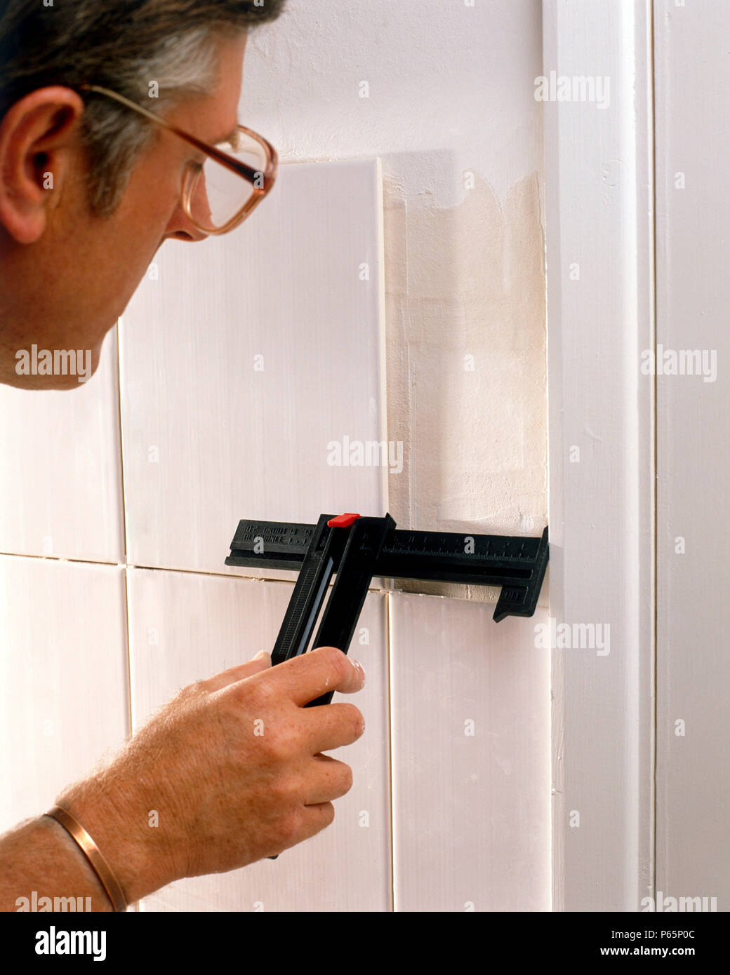 Tiling in progress Stock Photo - Alamy