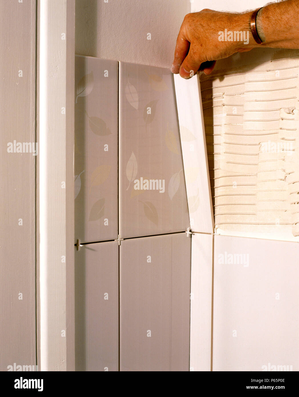 Tiling in progress Stock Photo - Alamy