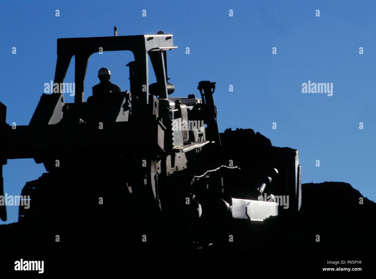 Bulldozer pushing dirt Stock Photo - Alamy