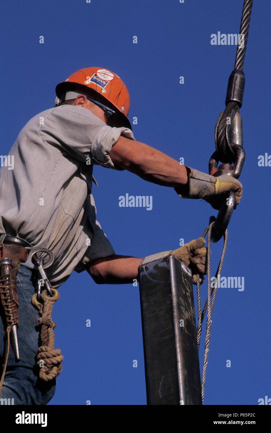 People working on removing the block hi-res stock photography and ...