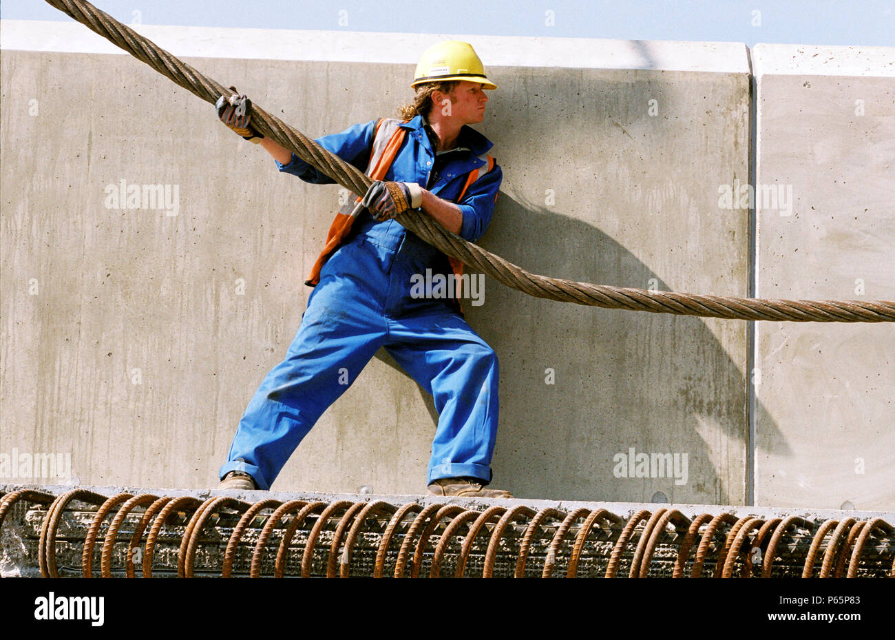 Construction workers in action Stock Photo - Alamy