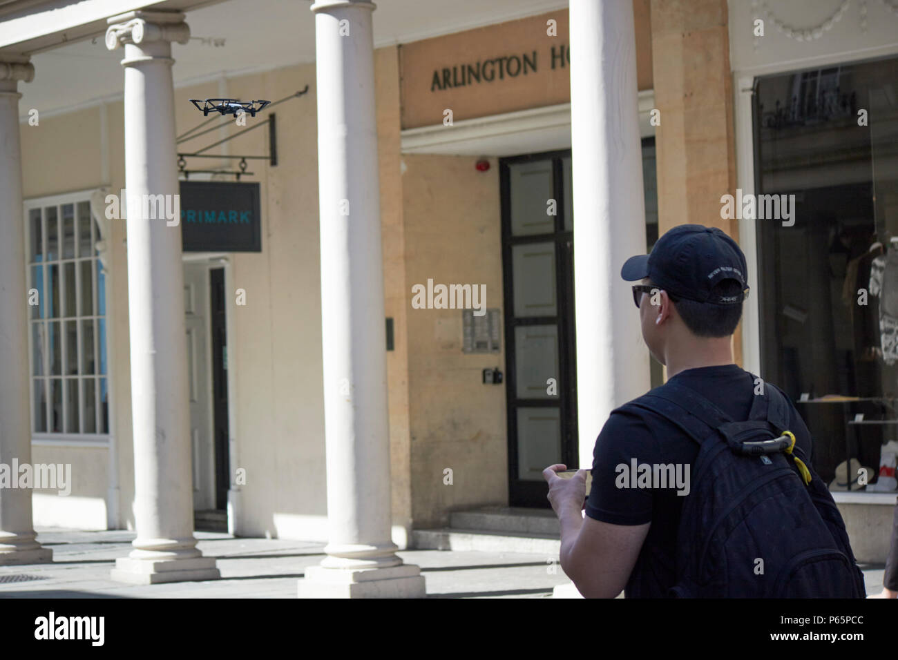 Drone flying in city street hi-res stock photography and images - Alamy