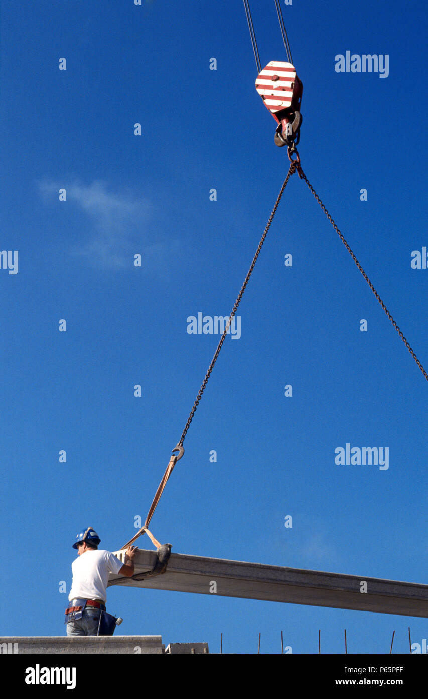 Building material delivered by a crane lift Stock Photo - Alamy