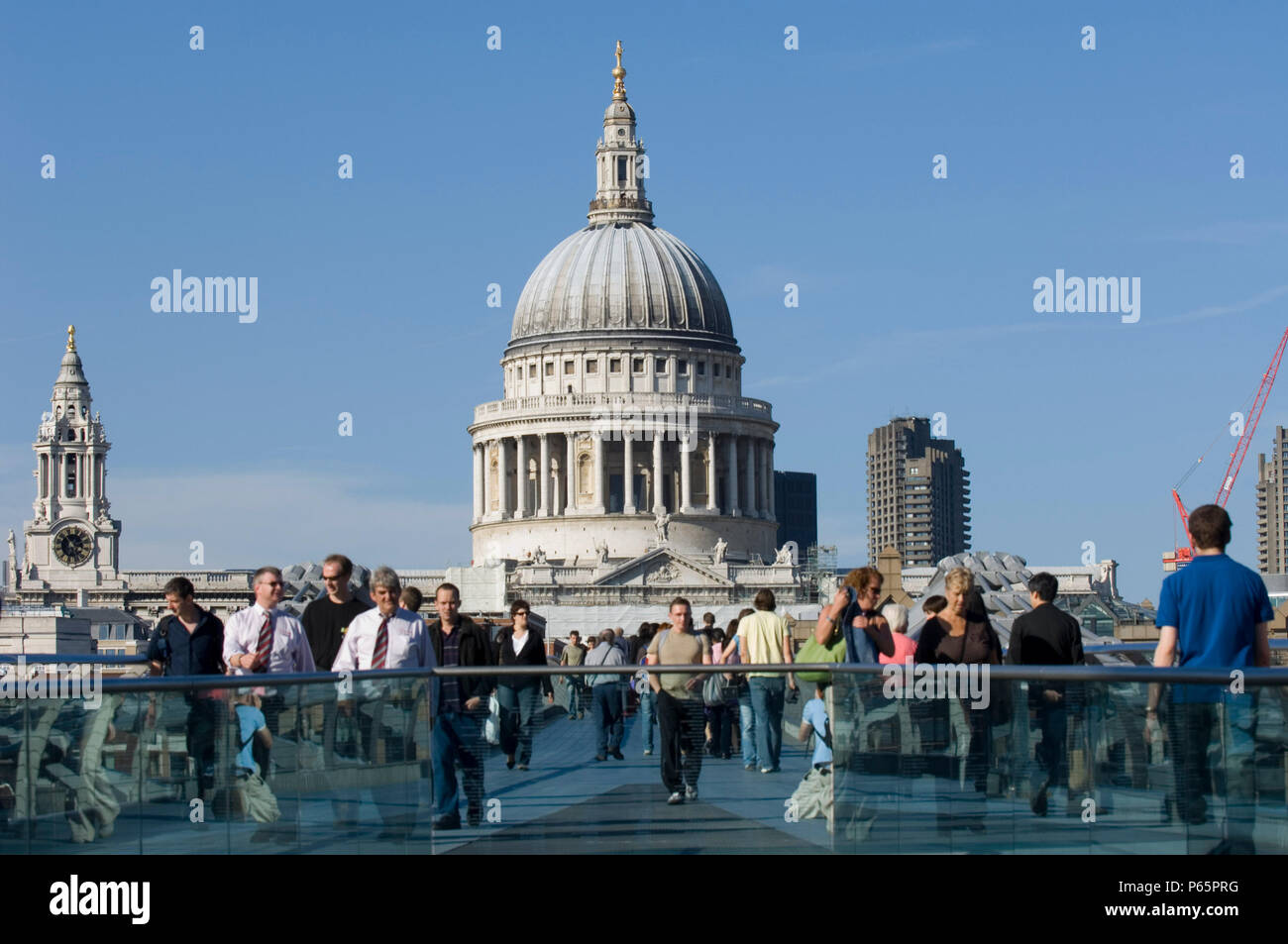 Group people walking millennium footbridge hi-res stock photography and ...
