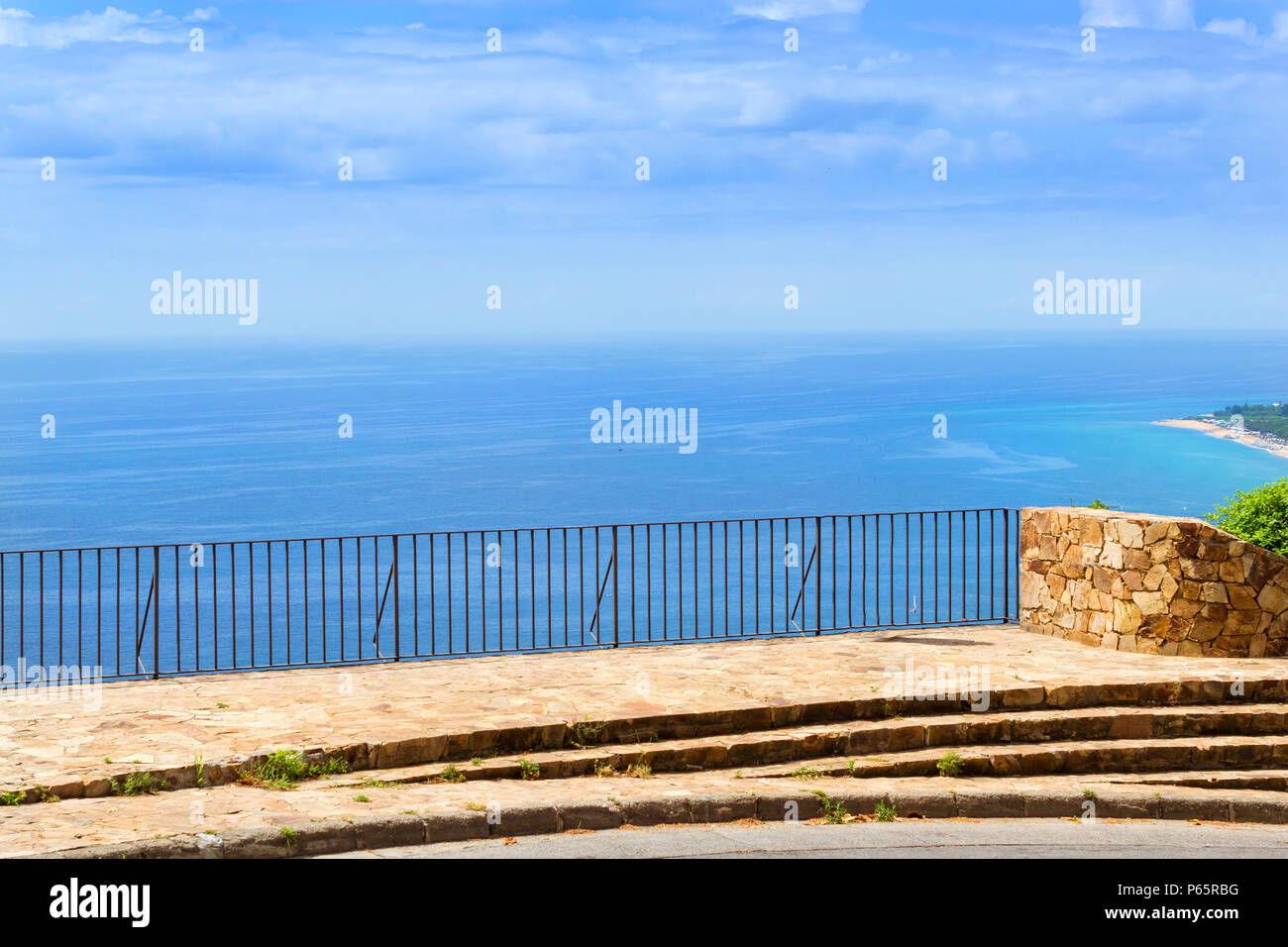 Panorama of sunny beach coast from height of stone observation deck ...