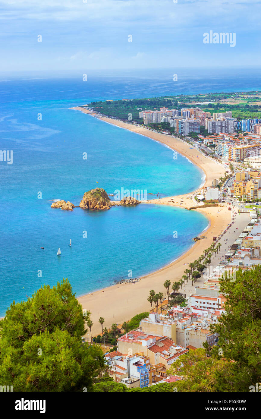 Rock Sa Palomera on coast of Spanish beach resort Blanes in summertime ...
