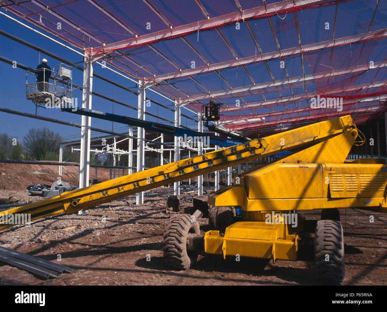 Inspecting Safety Netting and Cladding Rails to steel frame, prior to ...