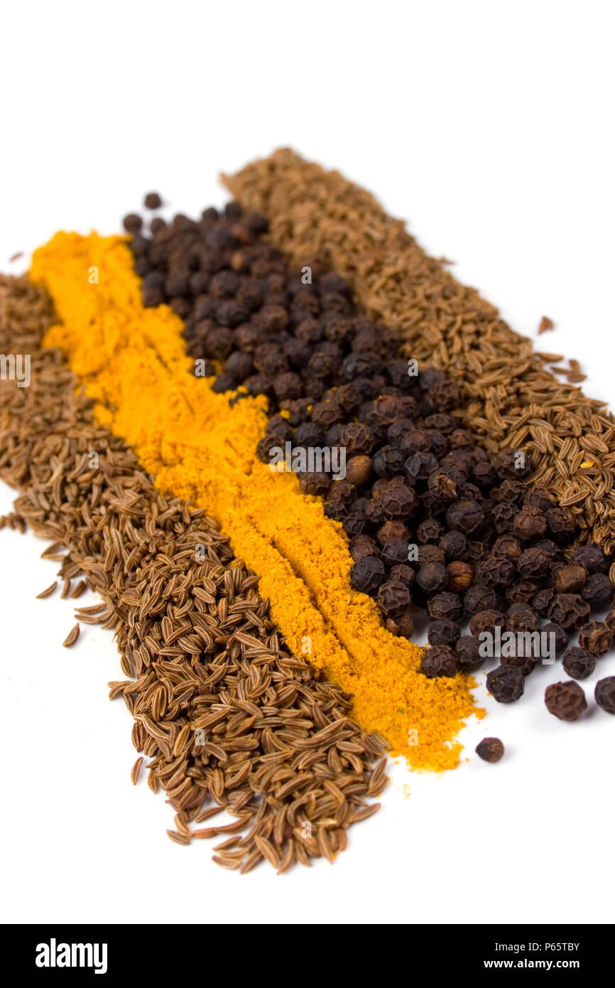 heaps of various spices closeup on white background Stock Photo - Alamy
