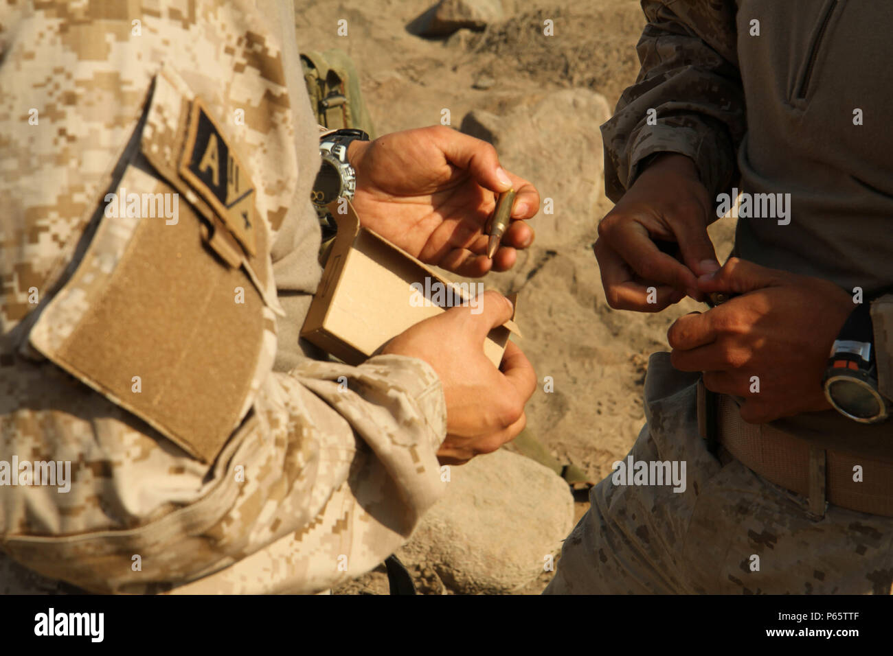 Team Chile loads live 5.56 mm ammunition into their magazine prior to ...