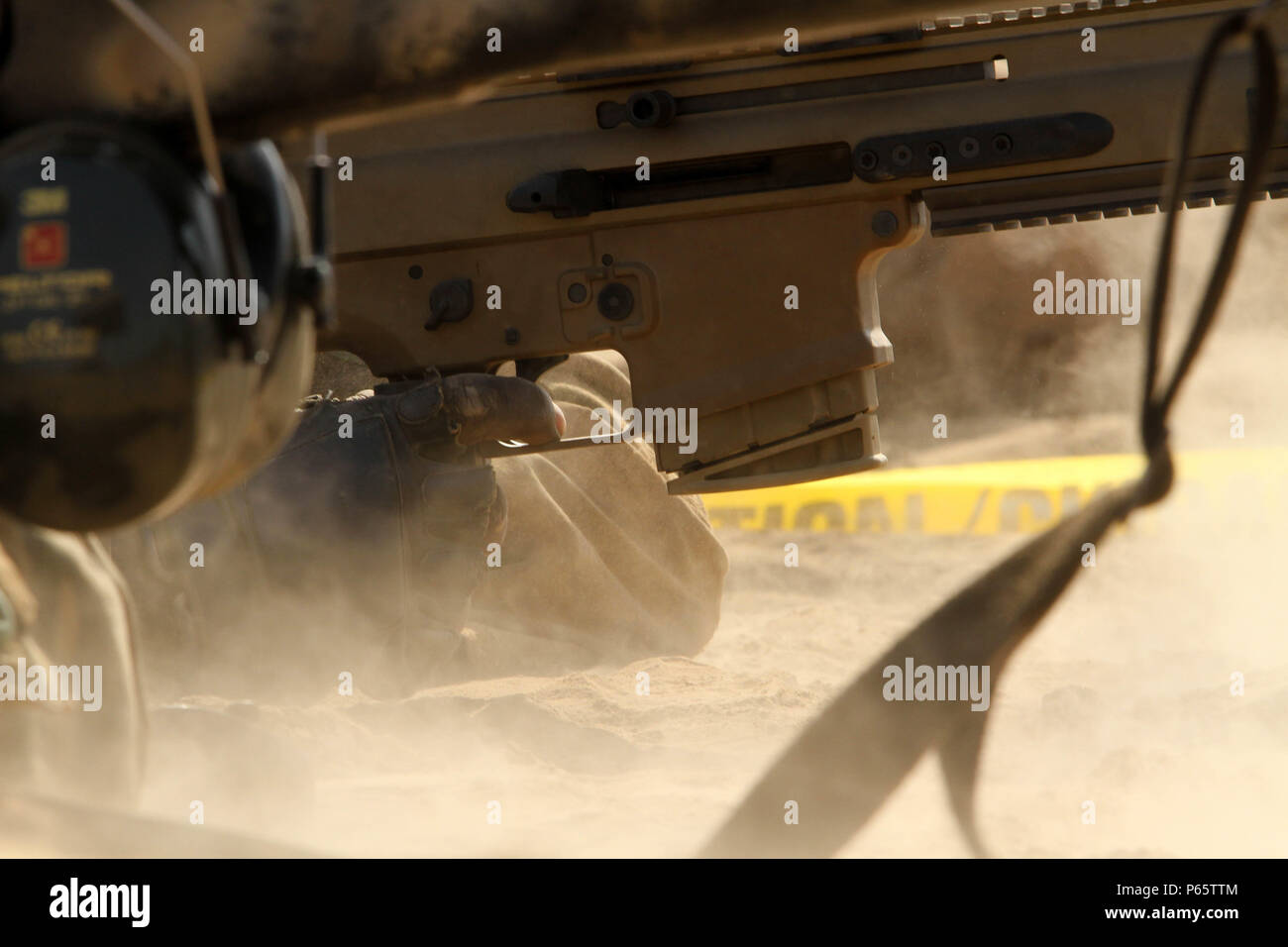 With his finger on the trigger a member of Team Suriname prepares to ...