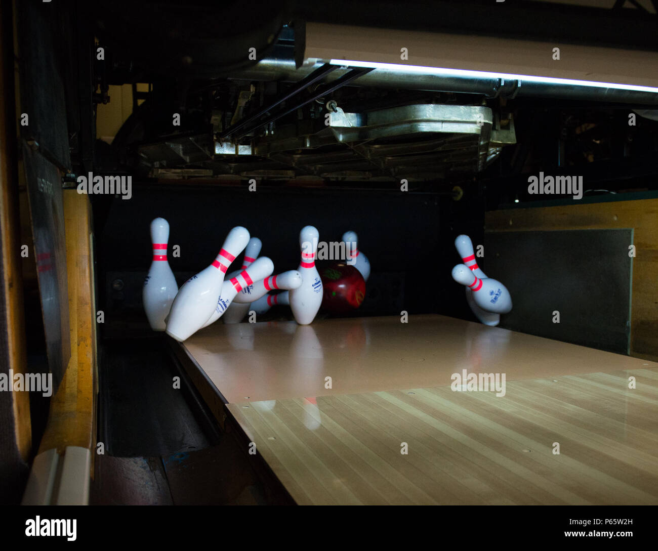 bowling pins get knocked down during the Armed Forces Bowling ...