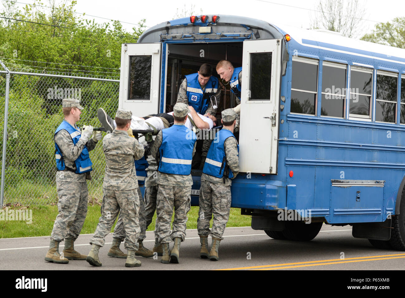 Members of the 88th Medical Operations Squadron load a patient onto an ...