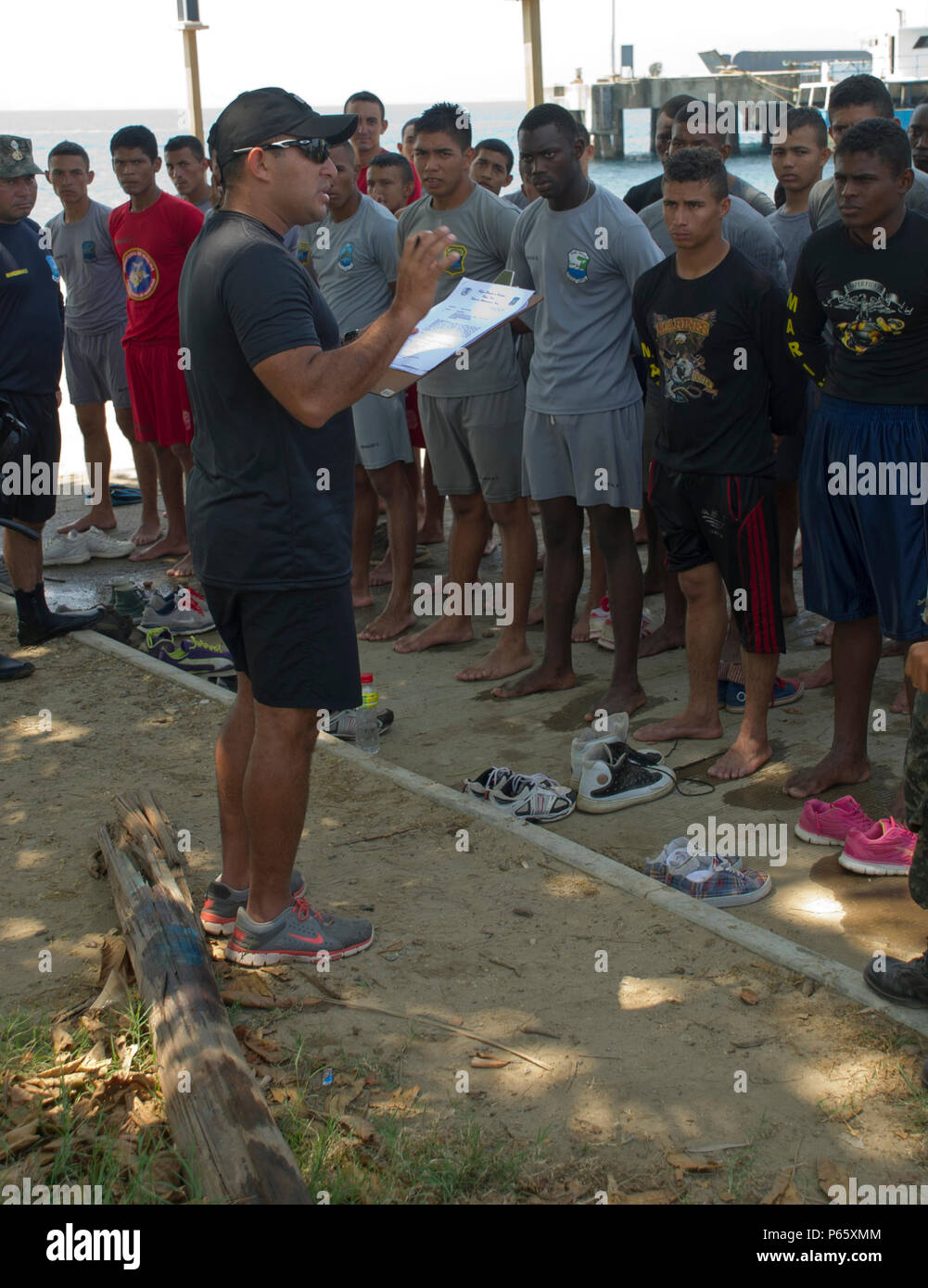 Honduran Navy Captain, Jose Gonzalez, provides feedback to a class of ...