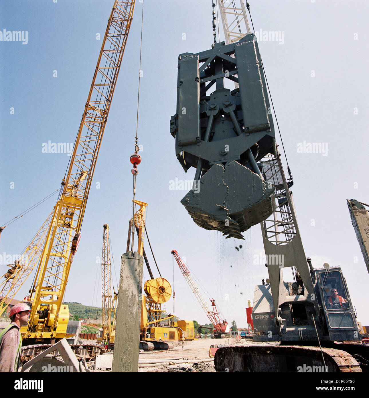 Mobile crane with excavation bucket Stock Photo - Alamy