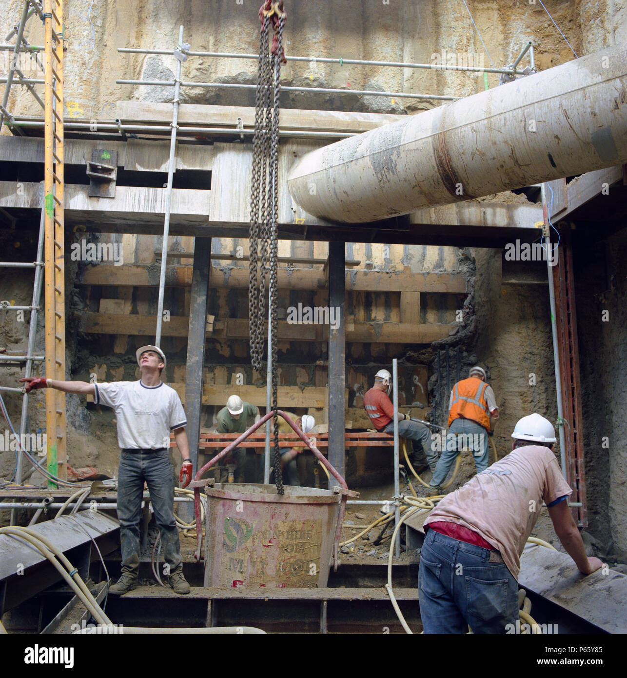 Lowering bucket in to shaft Stock Photo - Alamy