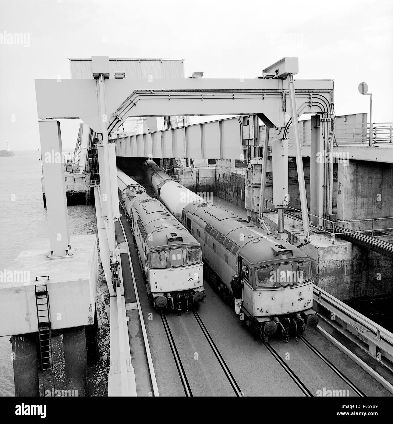 Goods train carrying freight Black and White Stock Photos & Images - Alamy