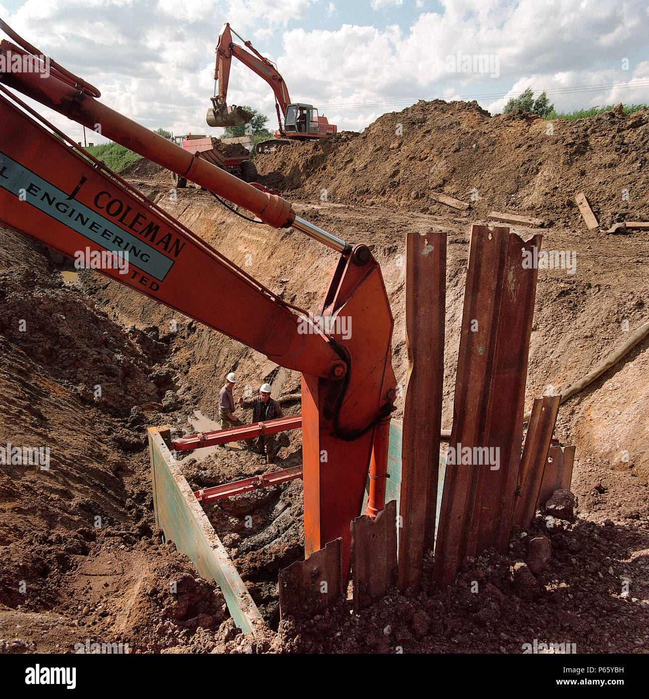 Excavating trench on the Essex marshes to install gas supply pipework ...