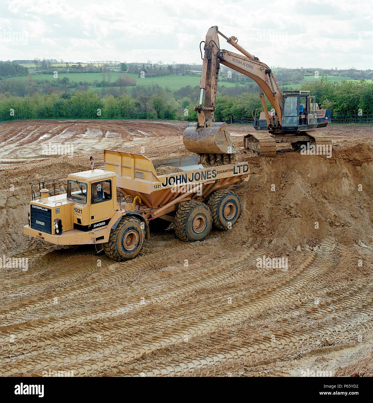 Caterpillar D400D articulated dumper truck and Komatsu crawler ...