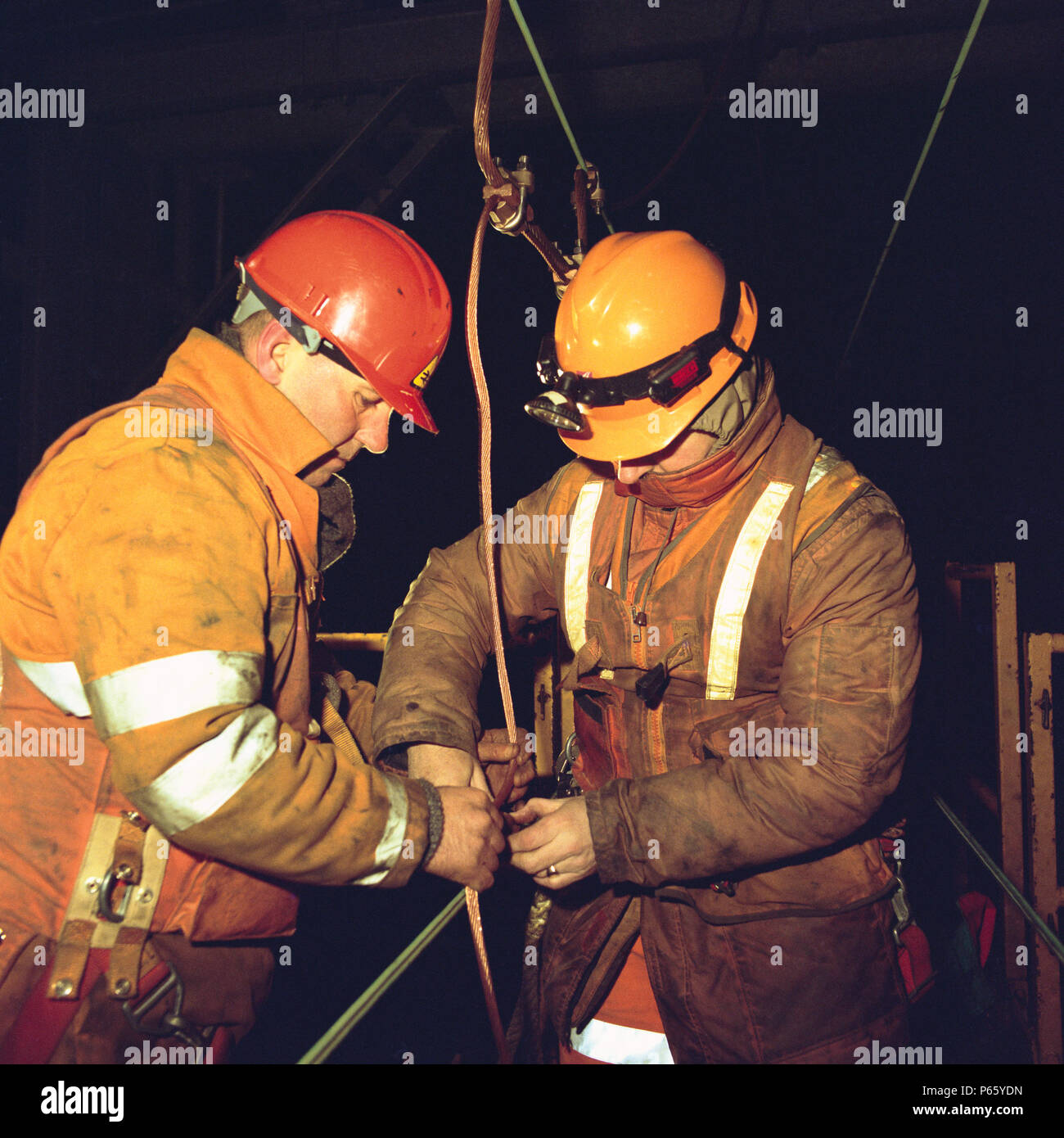 Attaching to safety line in tunnel Stock Photo - Alamy