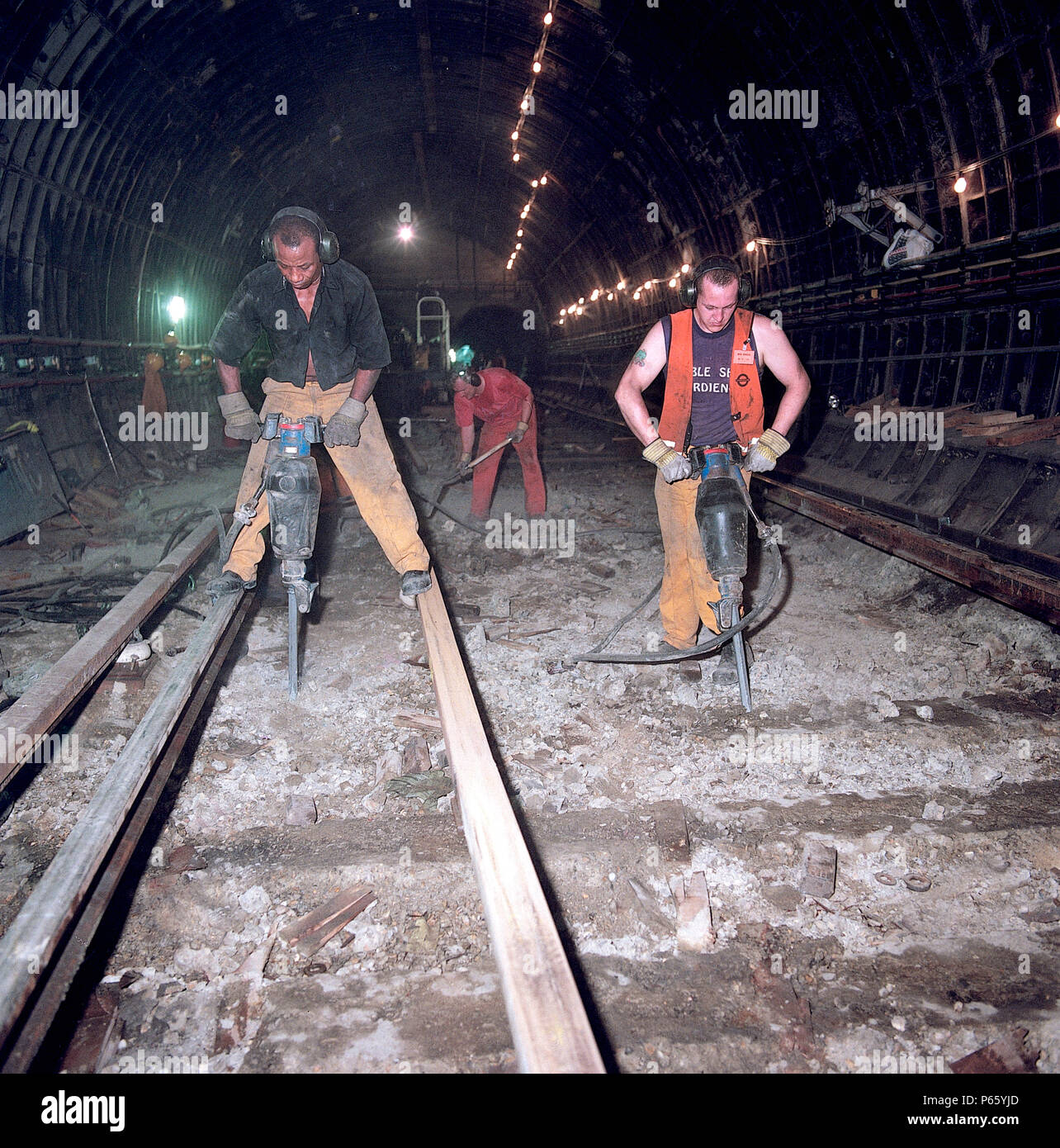 Excavating track bed during refurbishment of Angel Underground station ...