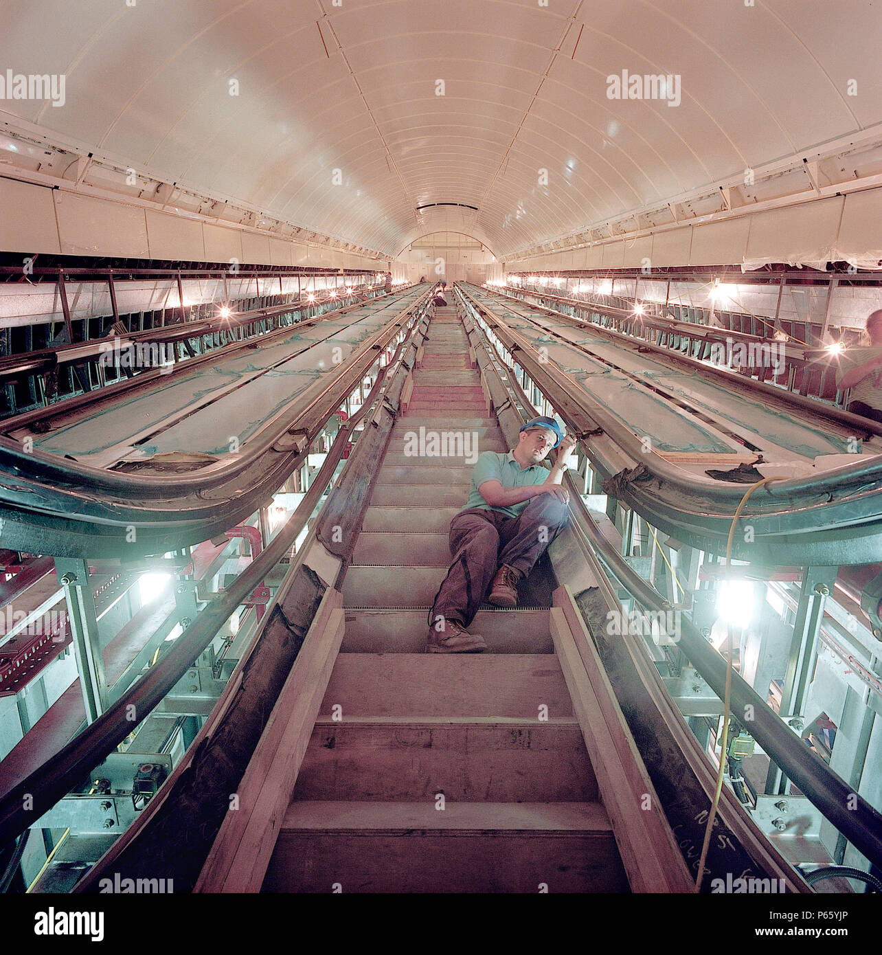 Escalator installation during refurbishment of Angel Underground ...