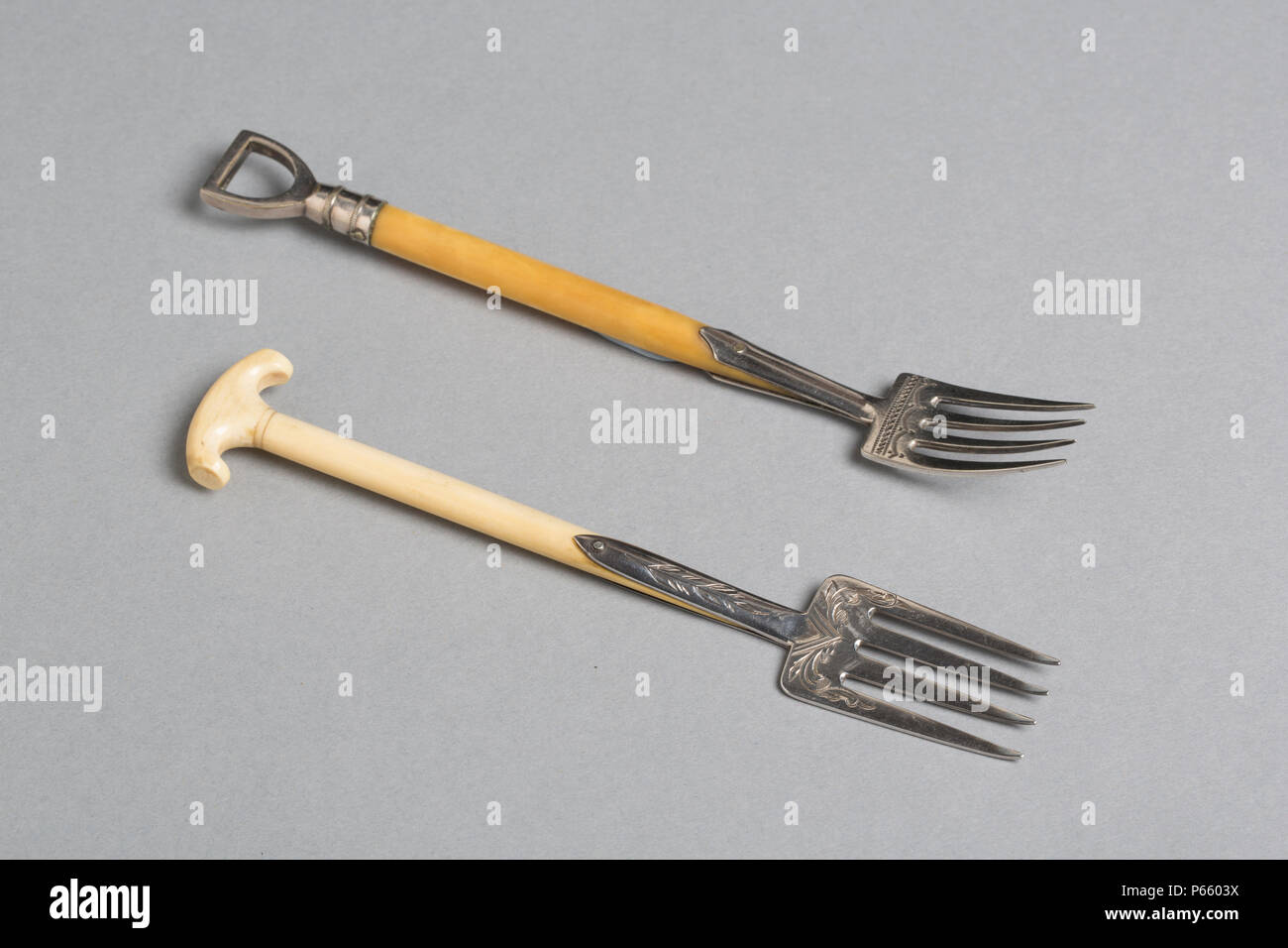 Ornamental Victorian serving forks Stock Photo - Alamy