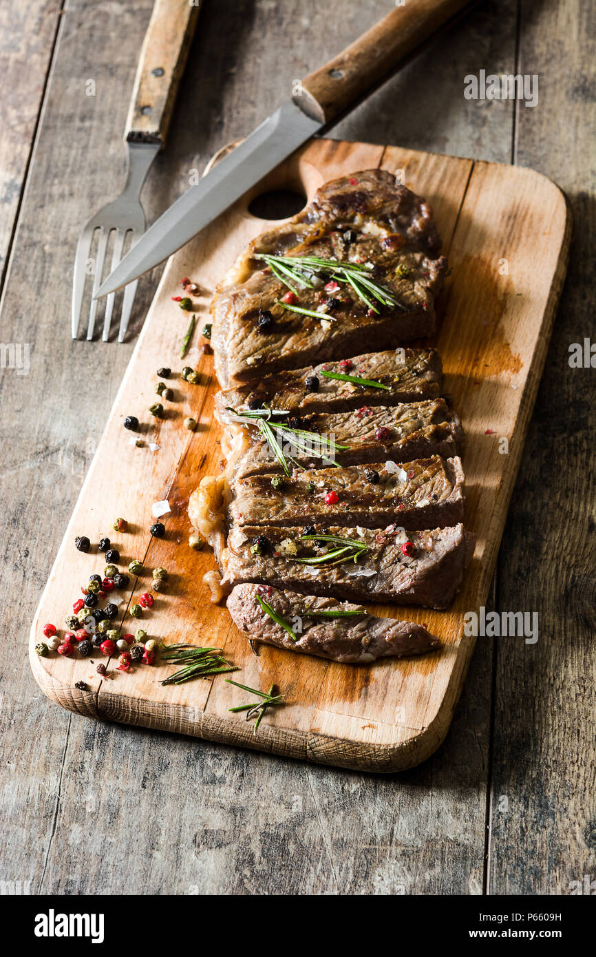 Grilled beef steak and spicy on rustic wooden background Stock Photo ...