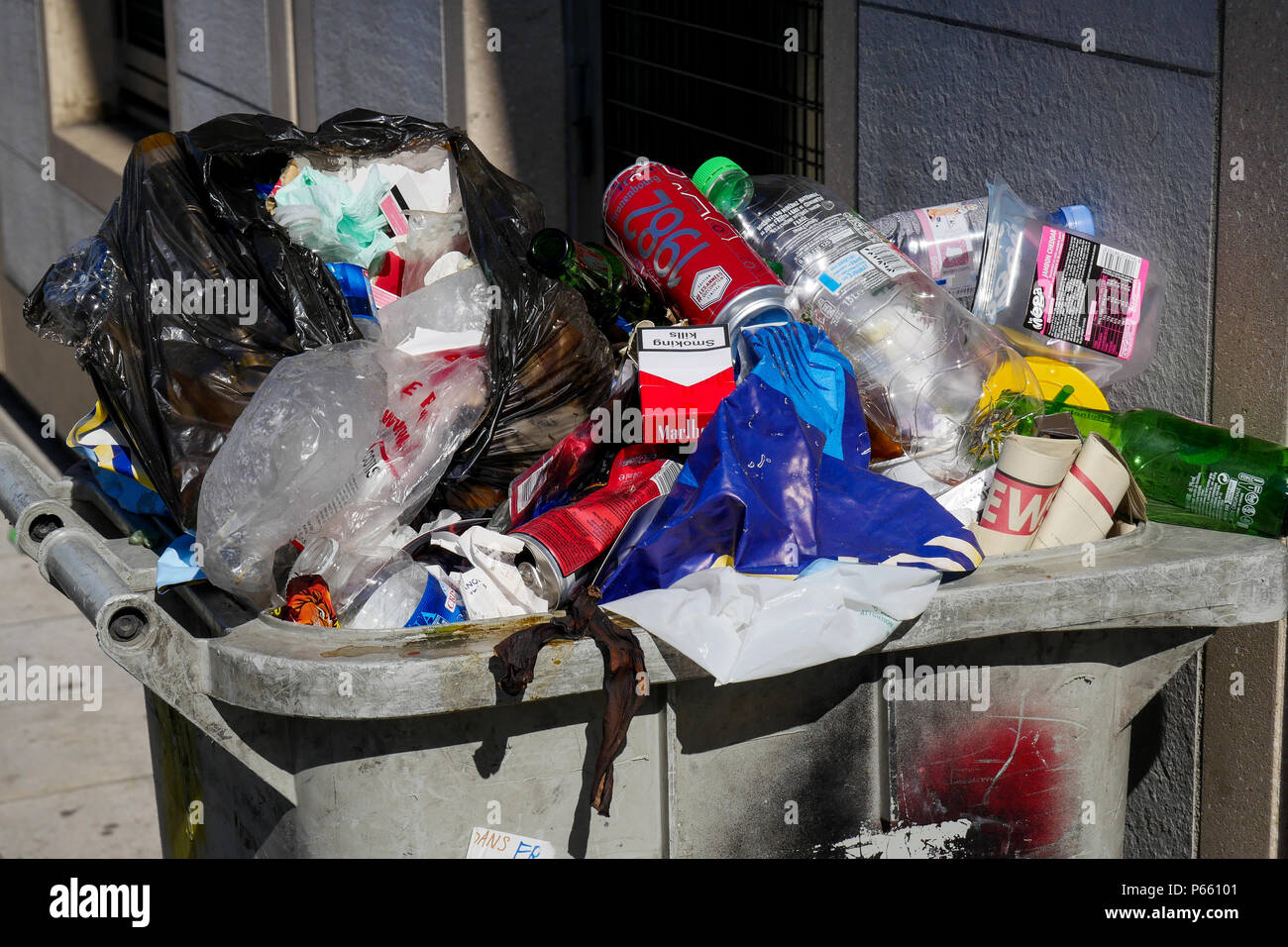 Garbage in a dustbin, Lyon, France Stock Photo - Alamy