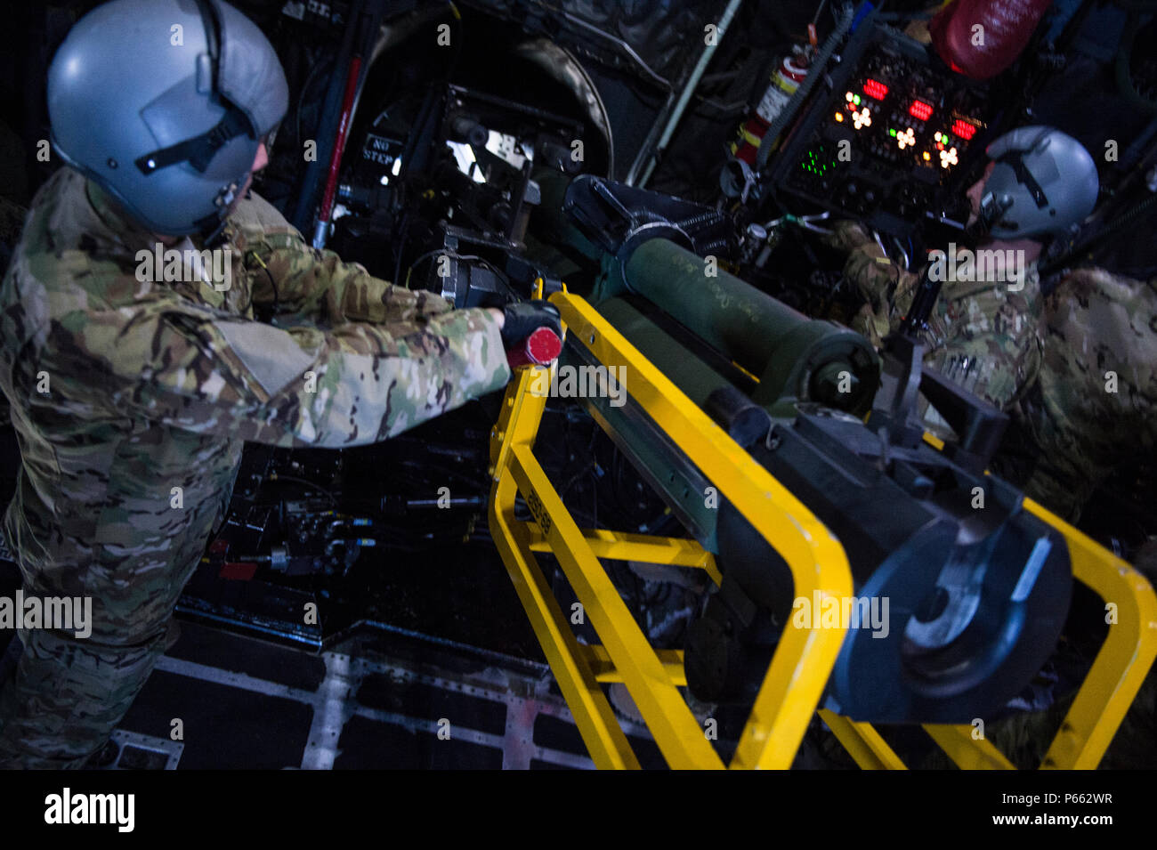 Aerial gunners with the 4th Special Operations Squadron operate the ...