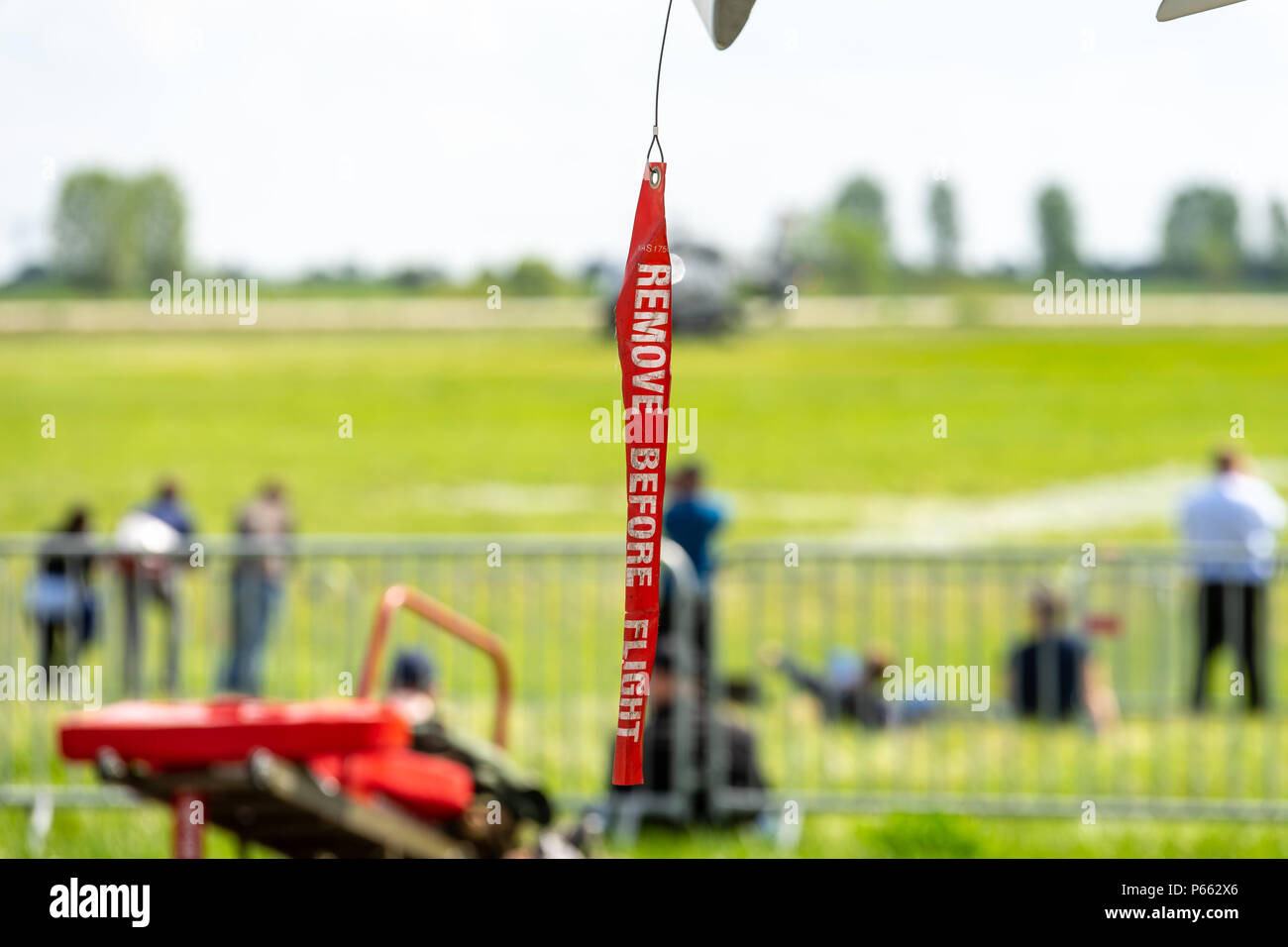 A remove before flight ribbon on a jet airplane. Close-up Stock Photo ...